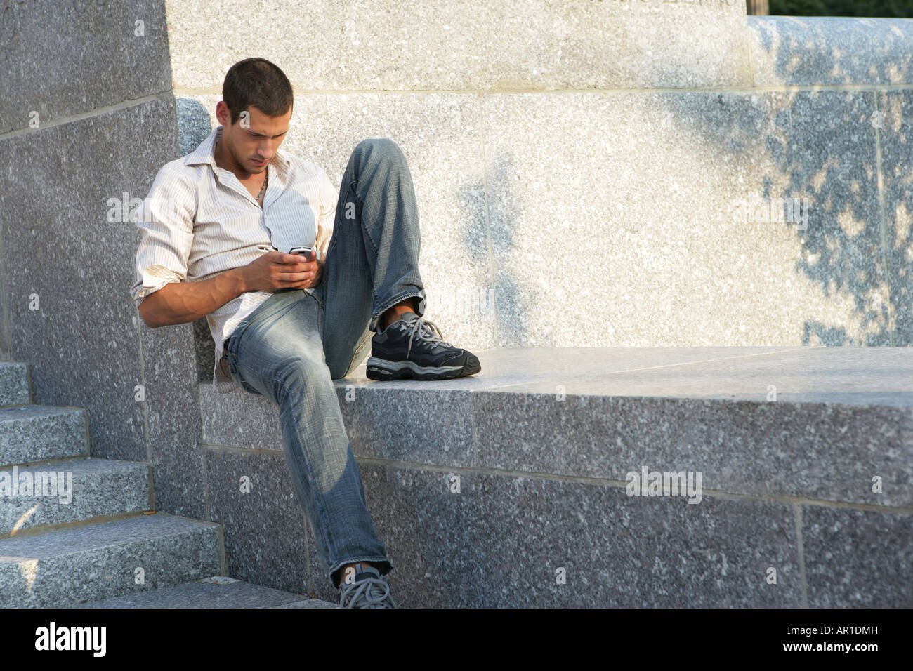 Man sitting on a ledge Stock Photo - Alamy Man sitting on a ledge Stock Photo - Alamy