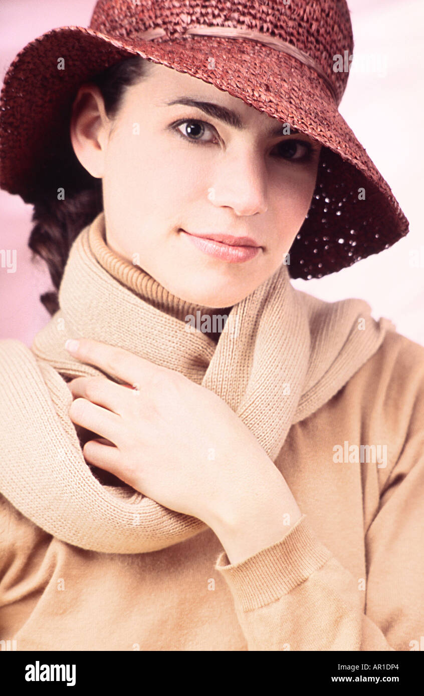 indoor studio close up woman 25 30 brunette make up hat red smile ...