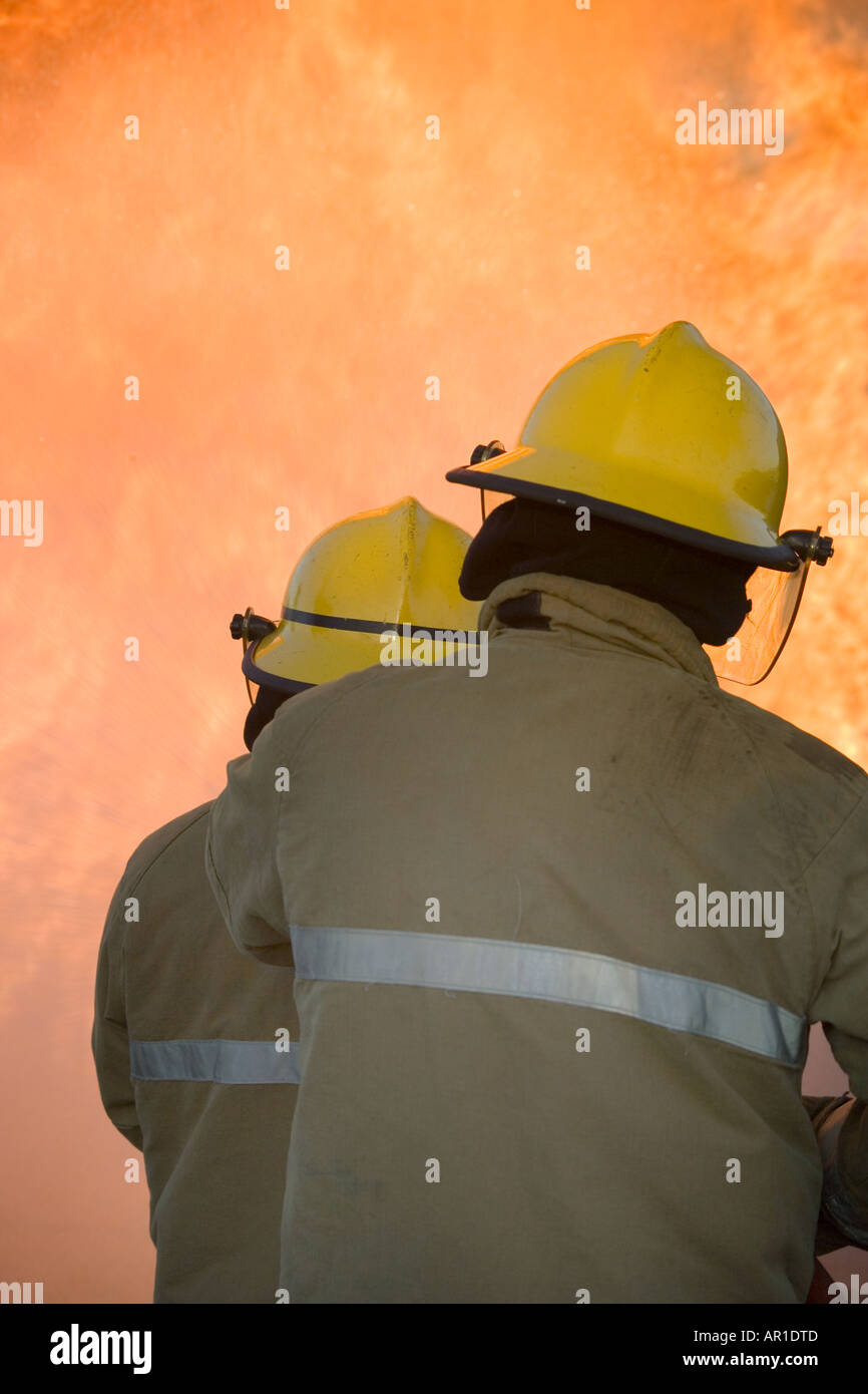 Fireman behind flames hi-res stock photography and images - Alamy