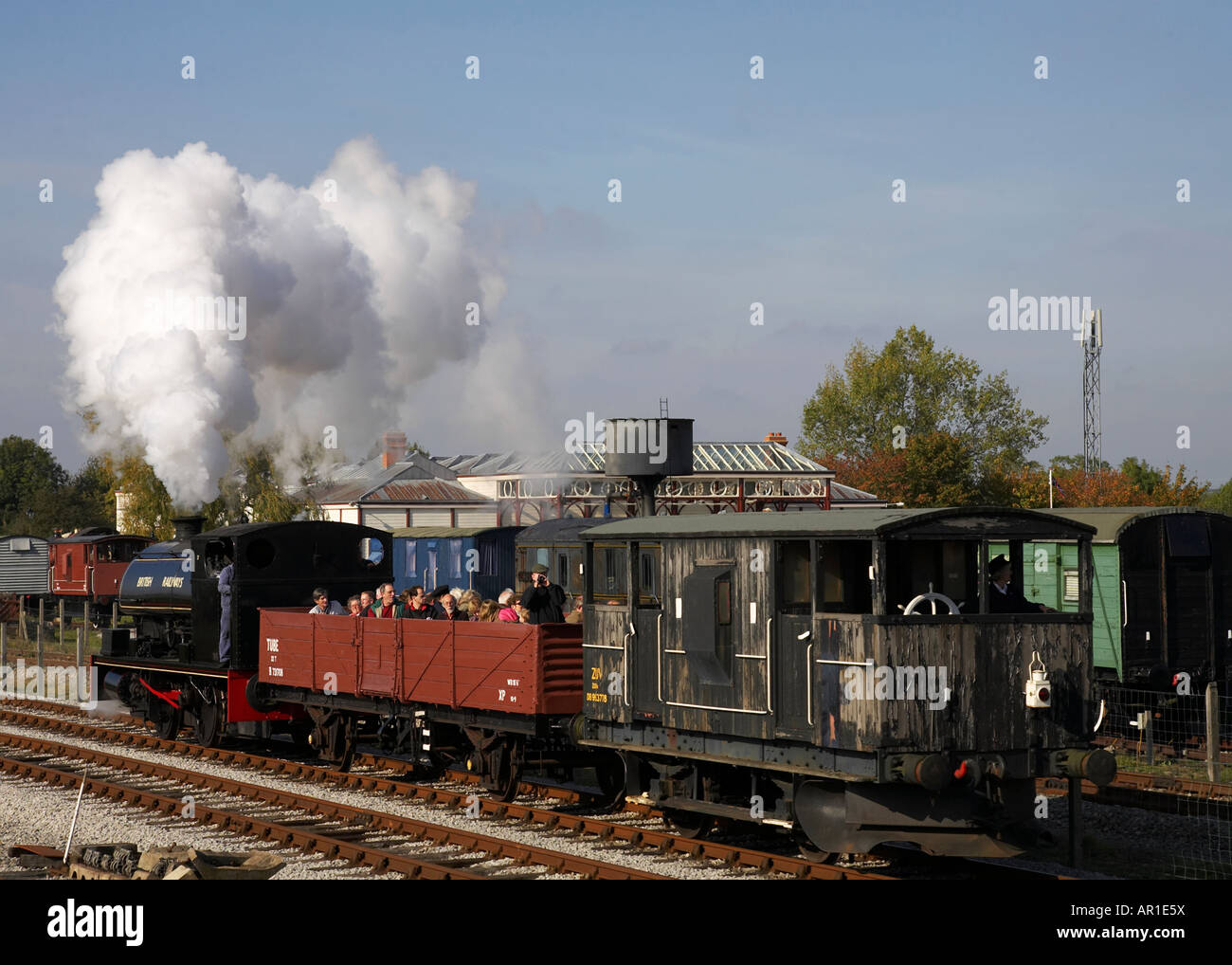 Old steam train pulling carrages Stock Photo - Alamy
