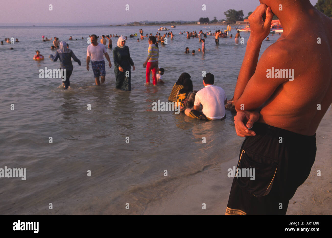 Arabs on the beach of Lattakia Stock Photo - Alamy