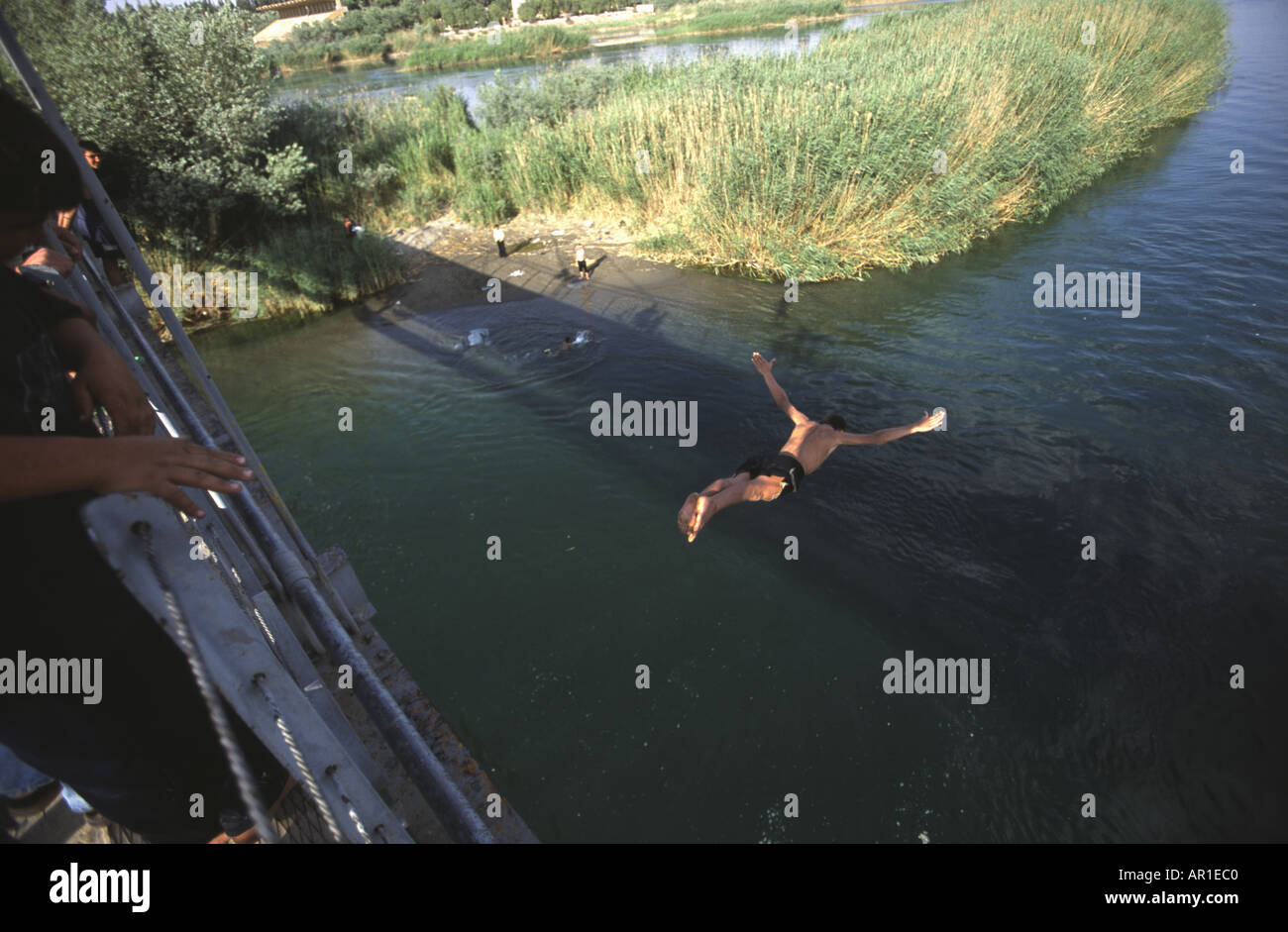 Boy dives into the Euphrates River Syria Stock Photo - Alamy