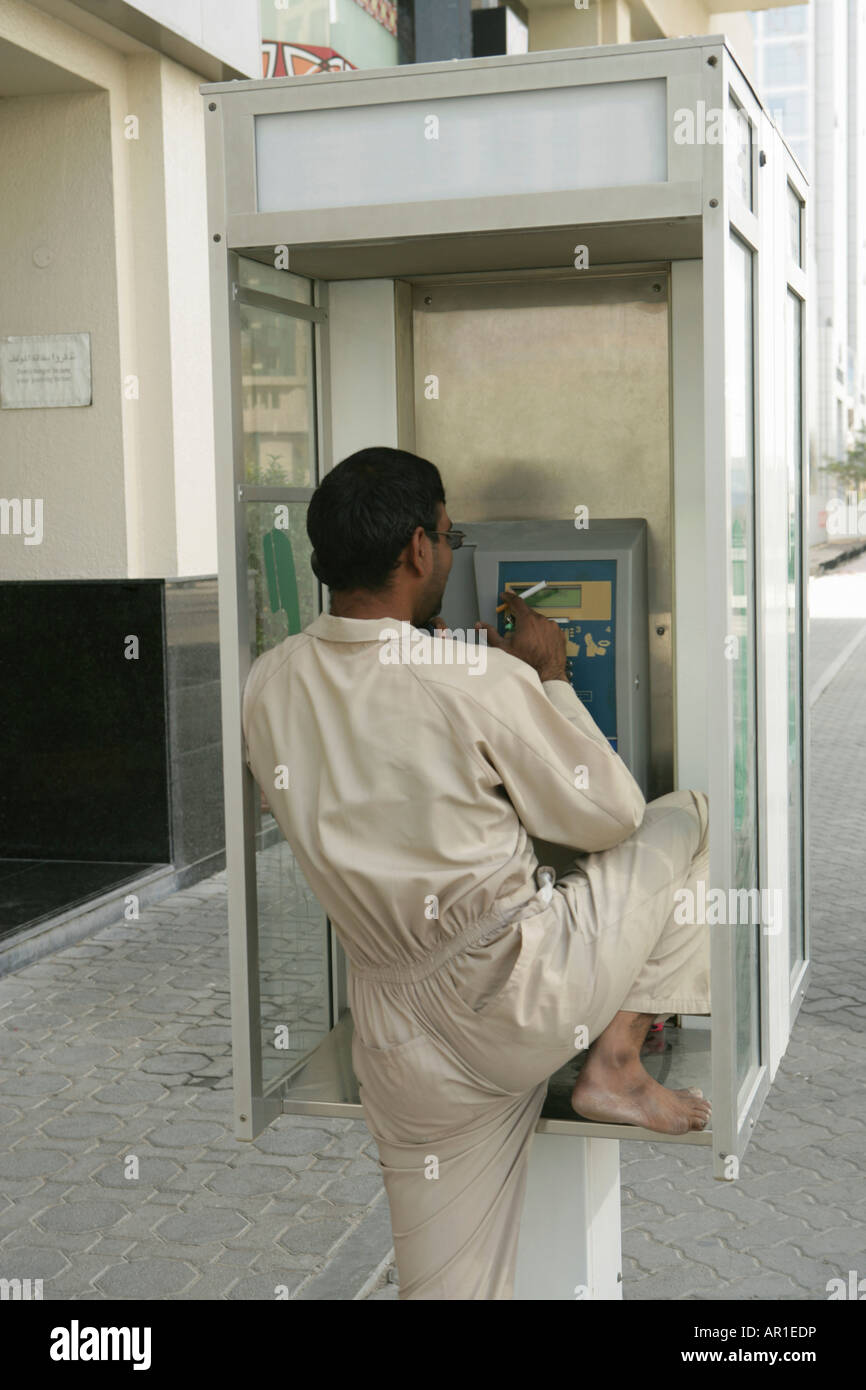A man on the phone booth Stock Photo - Alamy