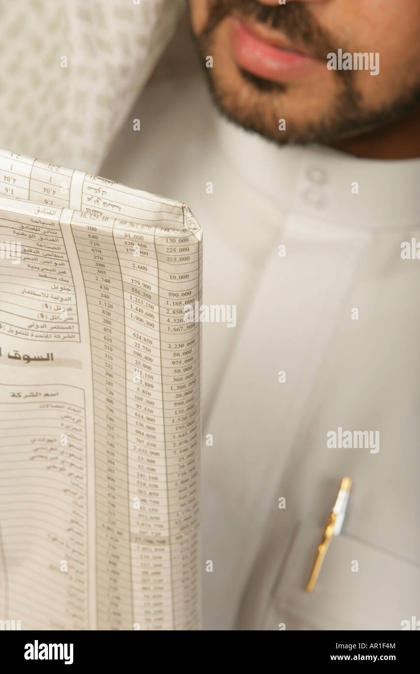 Arab Man reading the newspaper Stock Photo - Alamy