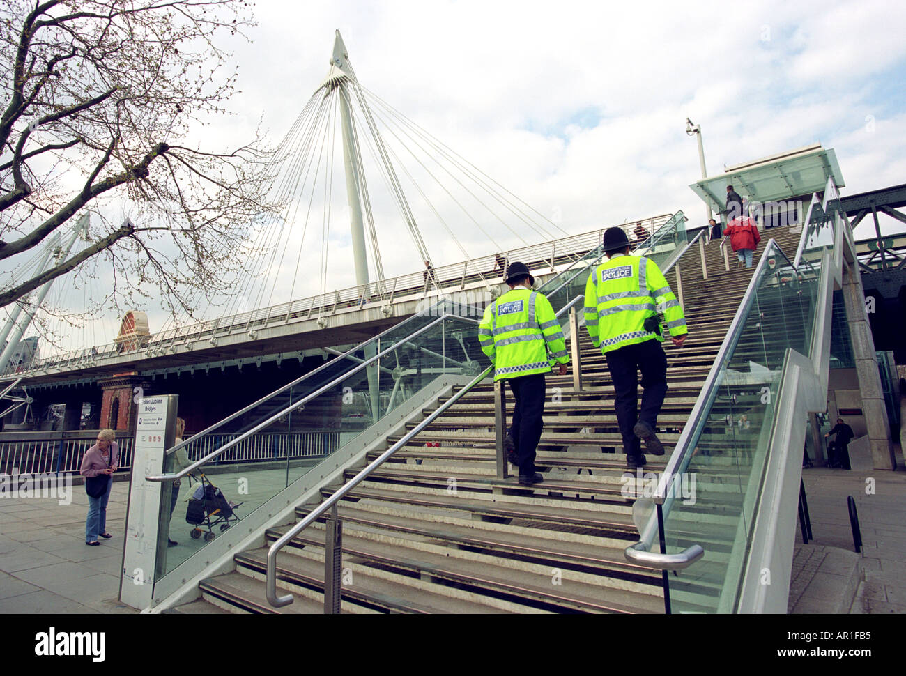 Police Officers on patrol at Hungerford Bridge in London England UK ...