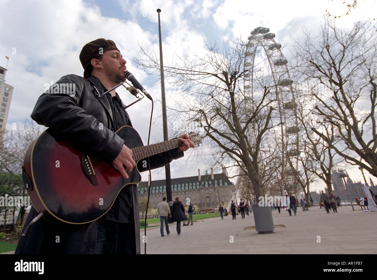 A street musician by the Millennium Wheel in London England UK Stock ...