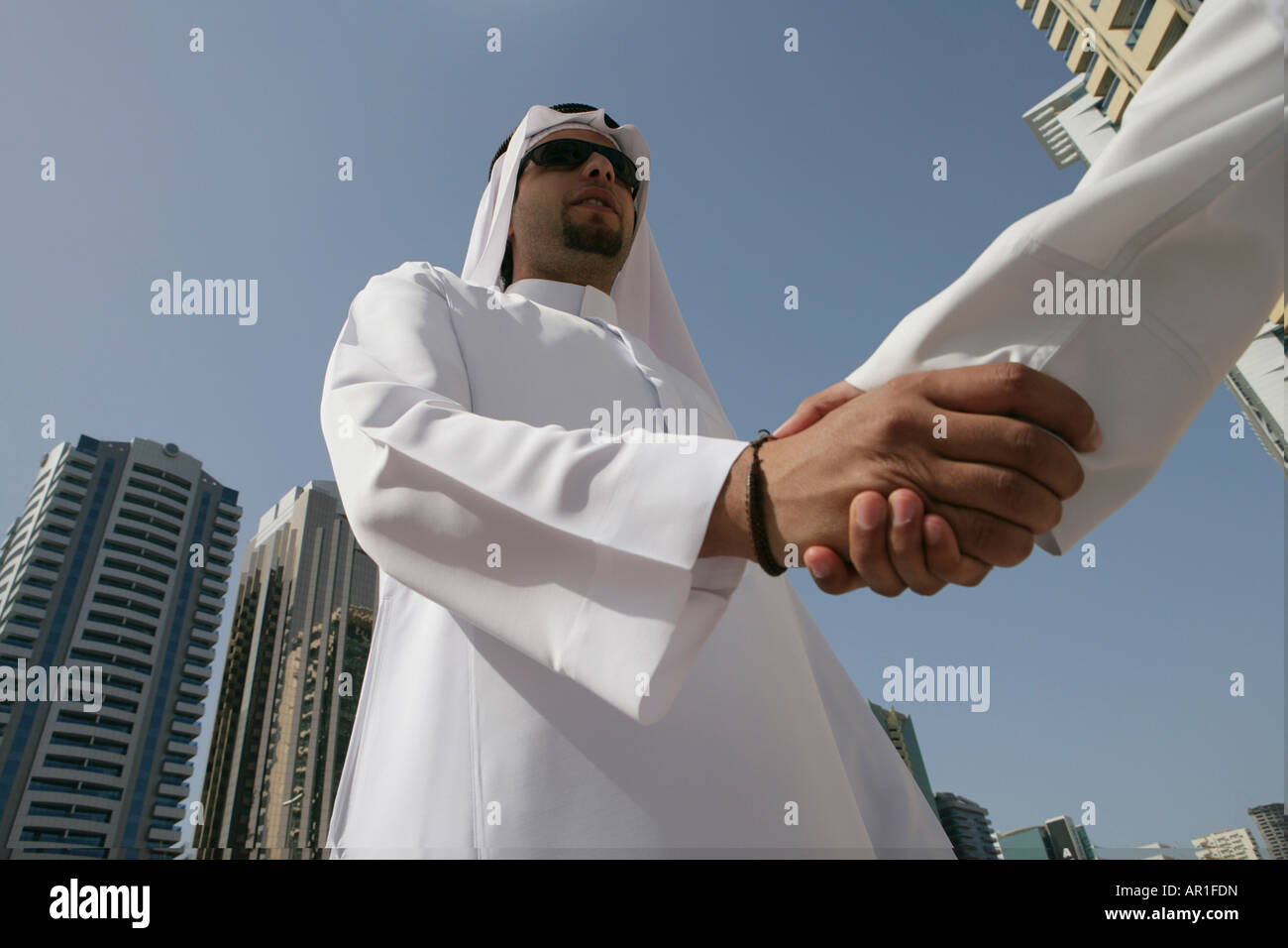 Arab Businessmen shaking hands Stock Photo - Alamy
