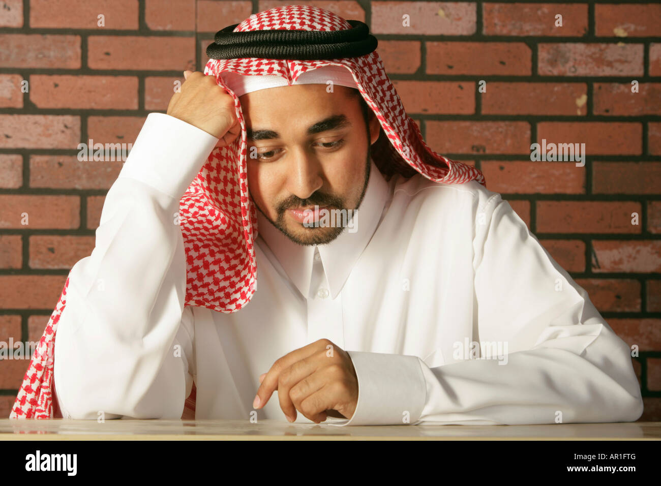 Arab Man showing tired and sad Stock Photo - Alamy