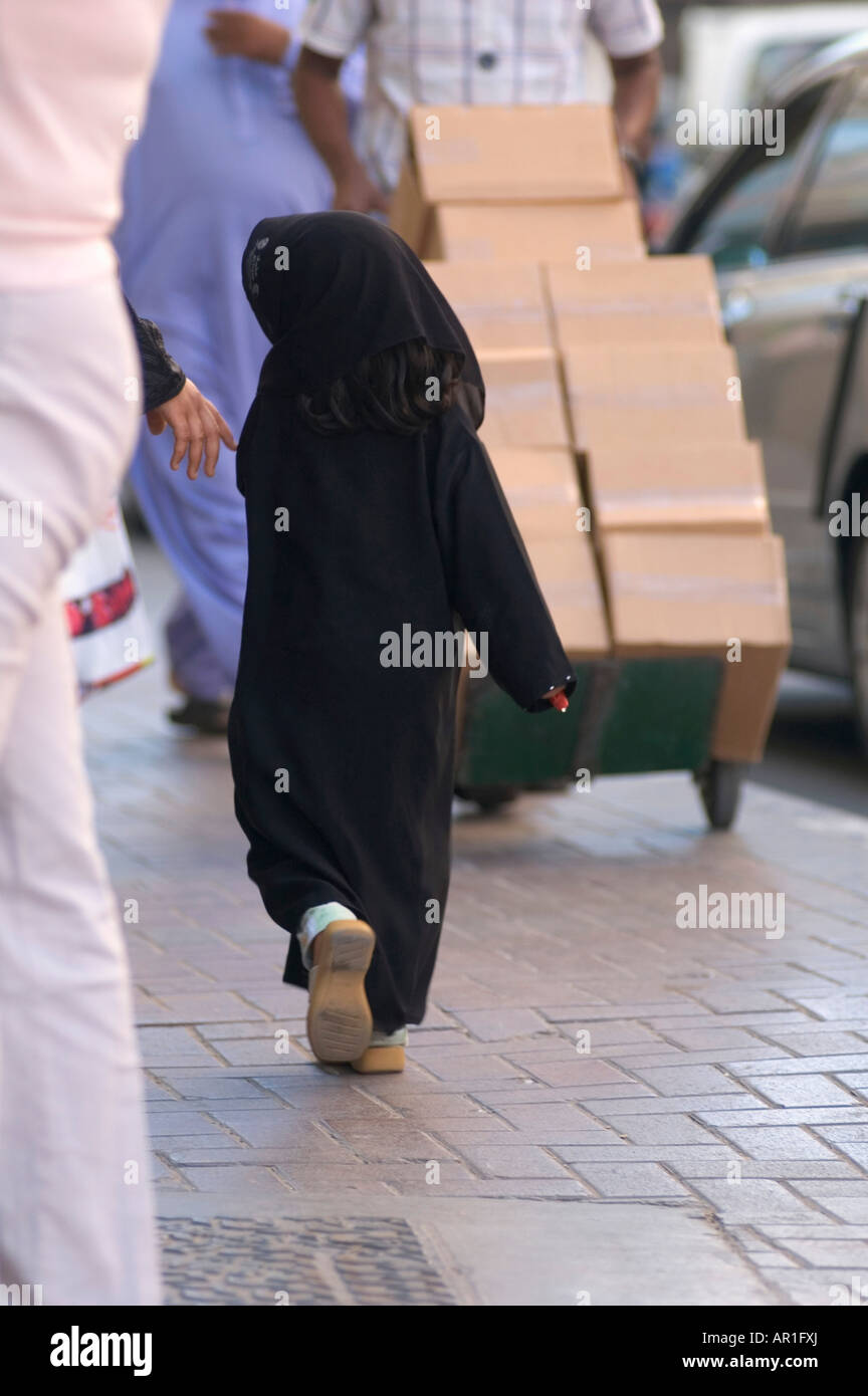 Arab Kid walks on the sidewalk Stock Photo - Alamy