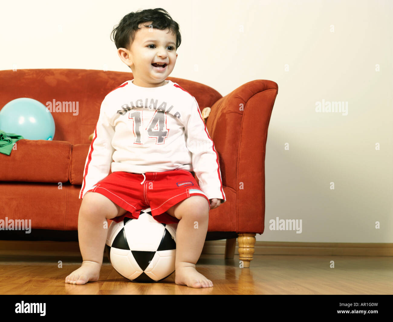 Baby playing the ball Stock Photo - Alamy