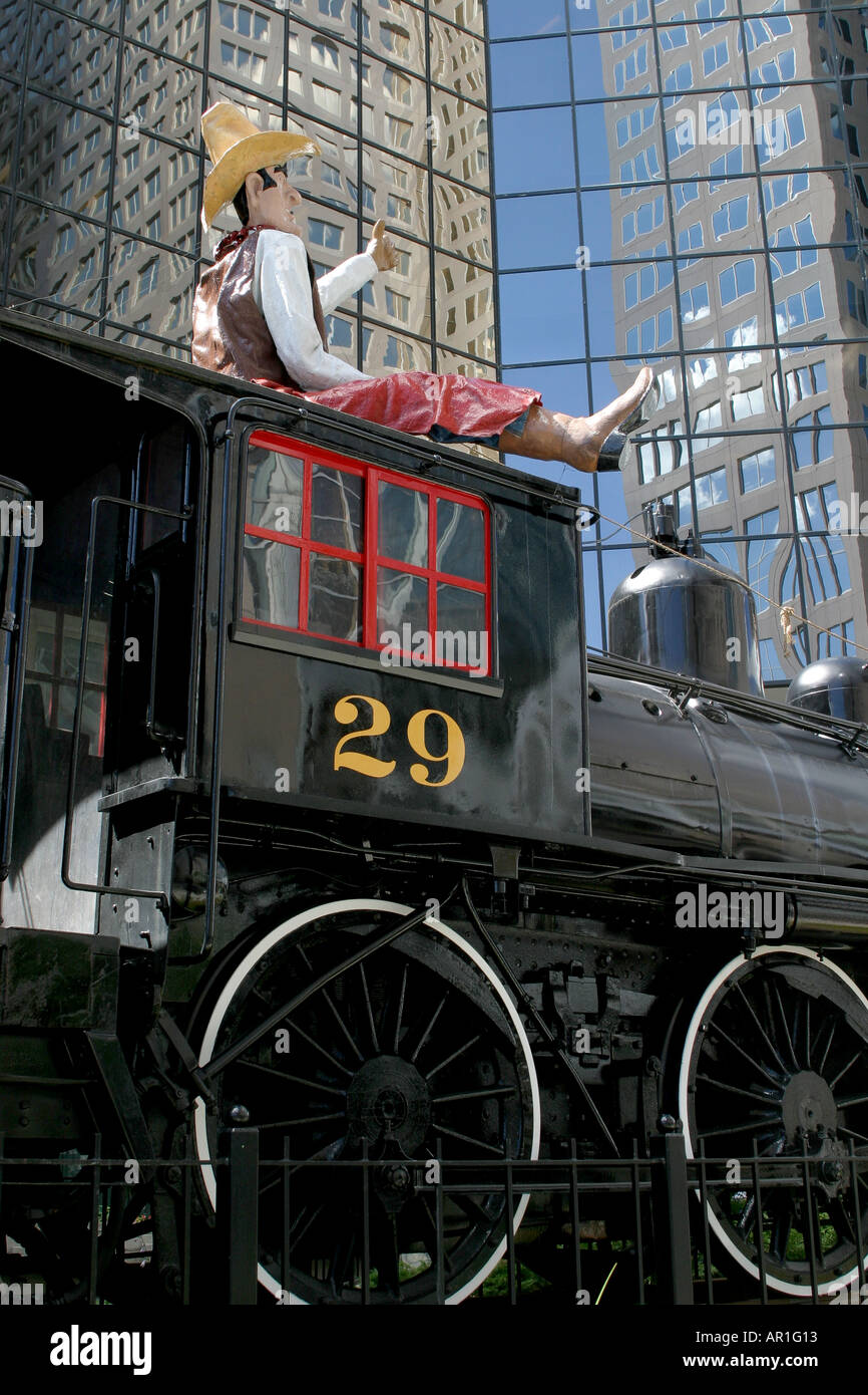 ARCHITECTURE cowboy sitting on a steam engine at the Calgary Stampede ...