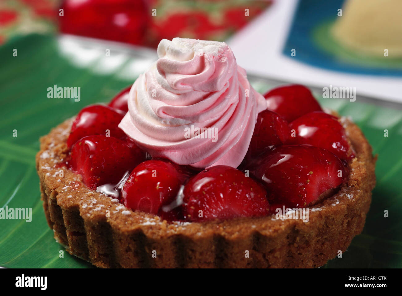 Raspberry with a cream toppings Stock Photo - Alamy
