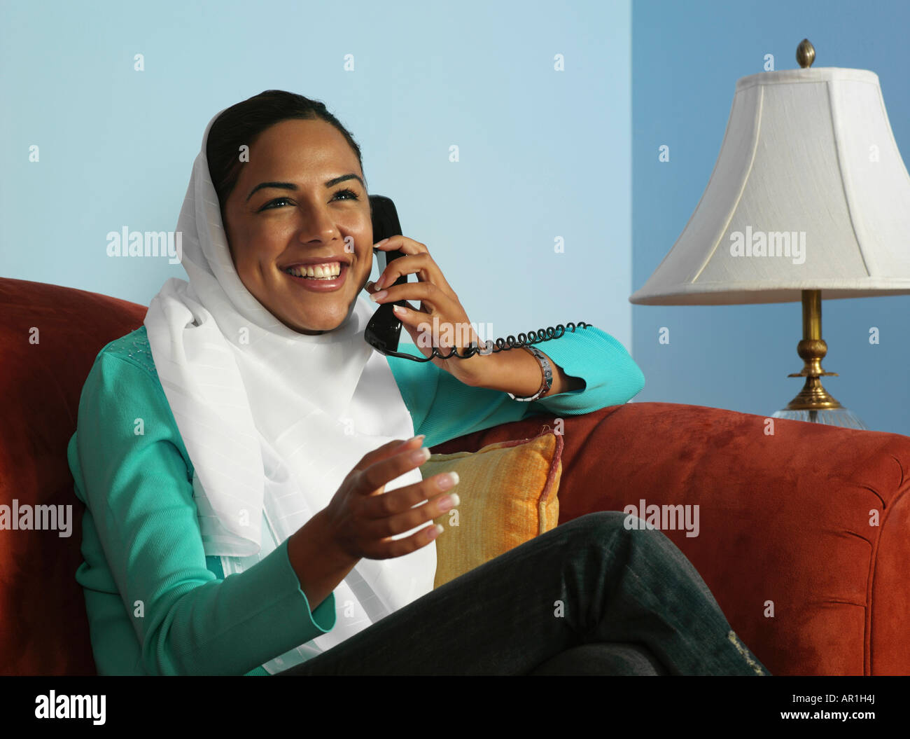 Arab lady busy on the phone Stock Photo - Alamy