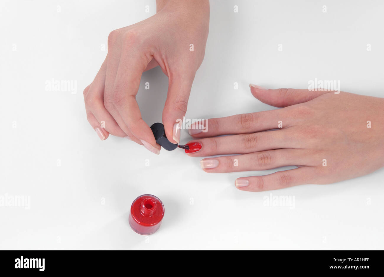 Applying nail polish Stock Photo - Alamy