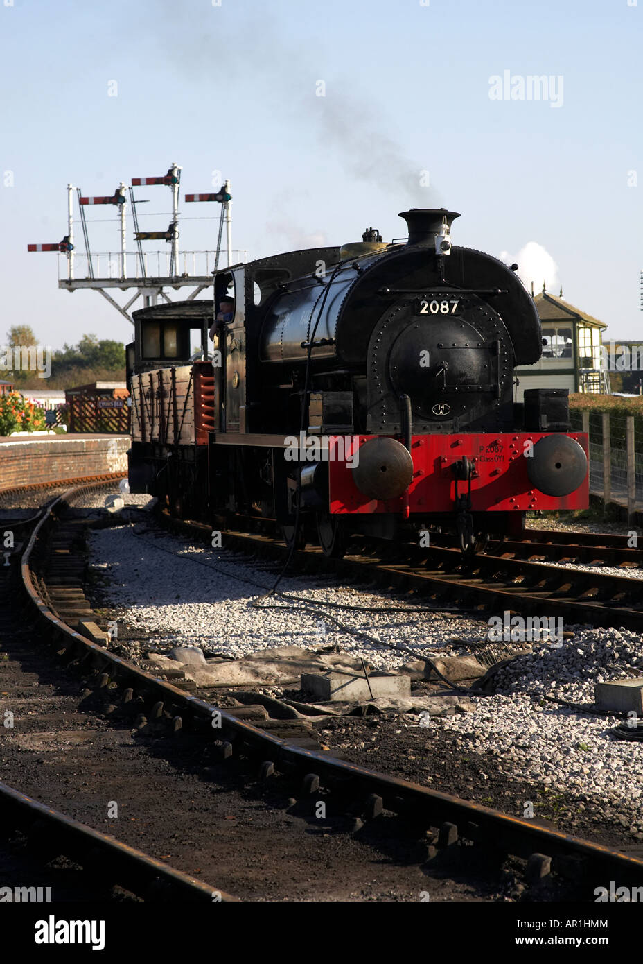 Steam train leaving station Stock Photo - Alamy