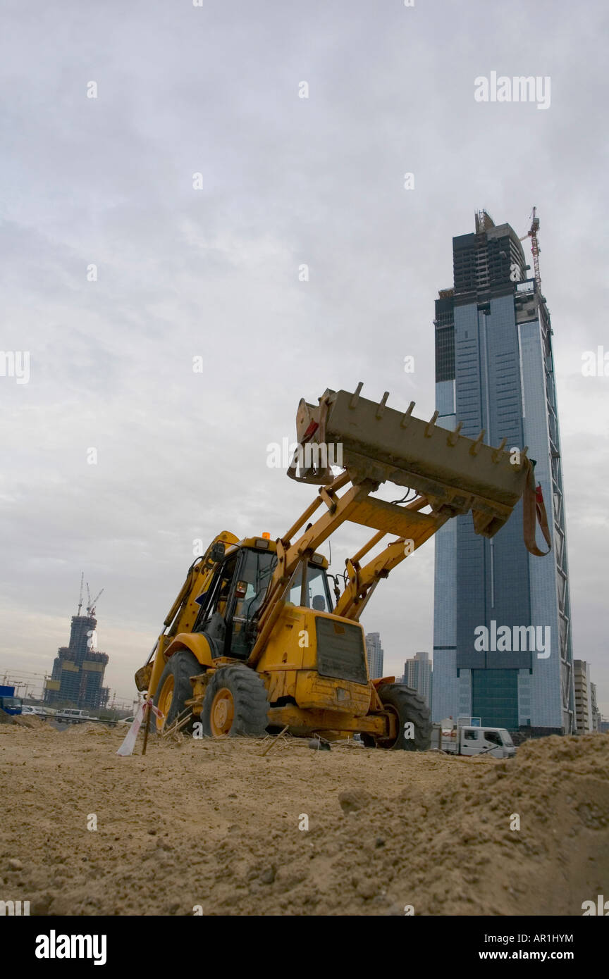 View of a machine digging the sand Stock Photo - Alamy