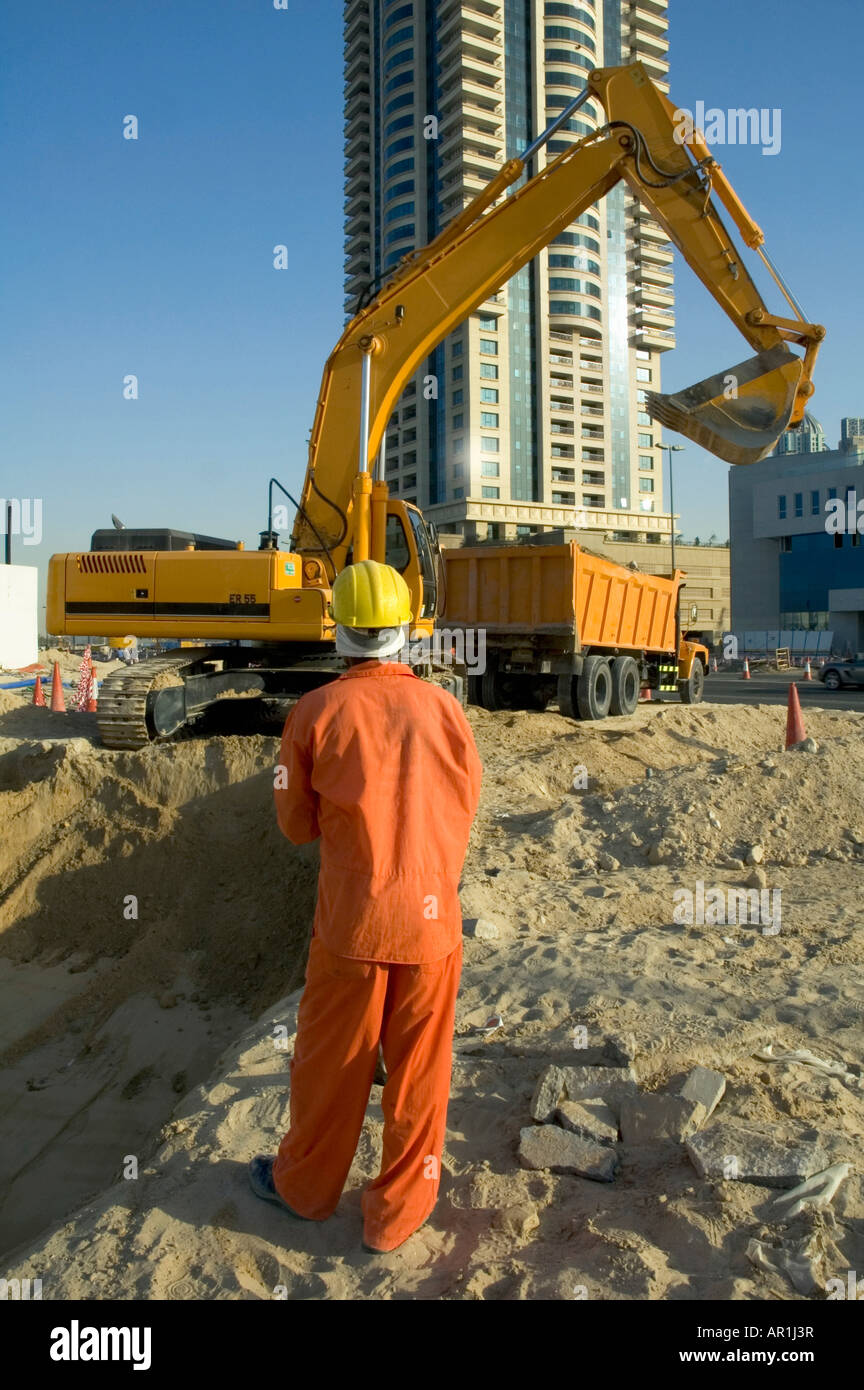 View of a machine digging the sand Stock Photo - Alamy