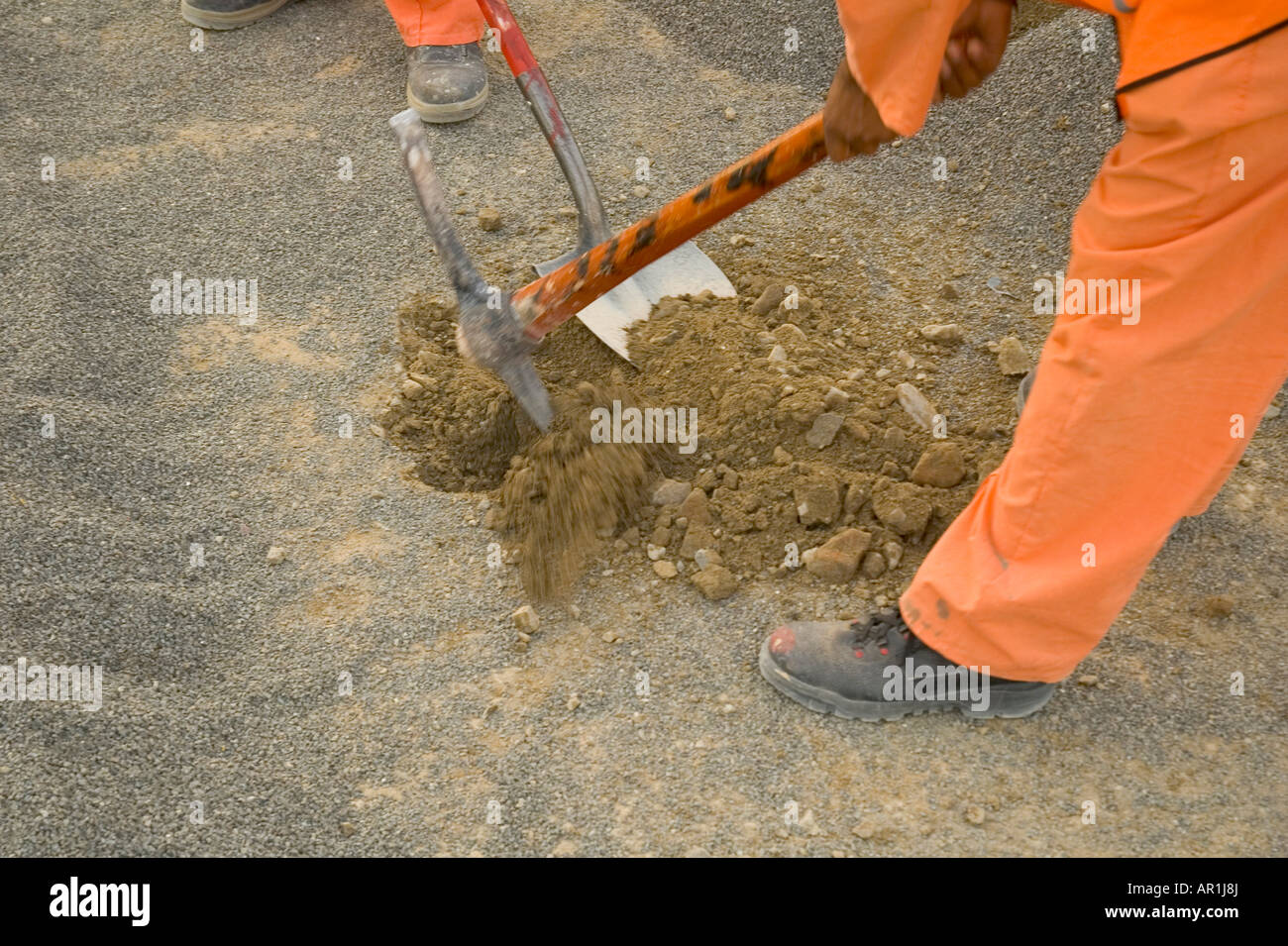 Man digging the ground Stock Photo - Alamy