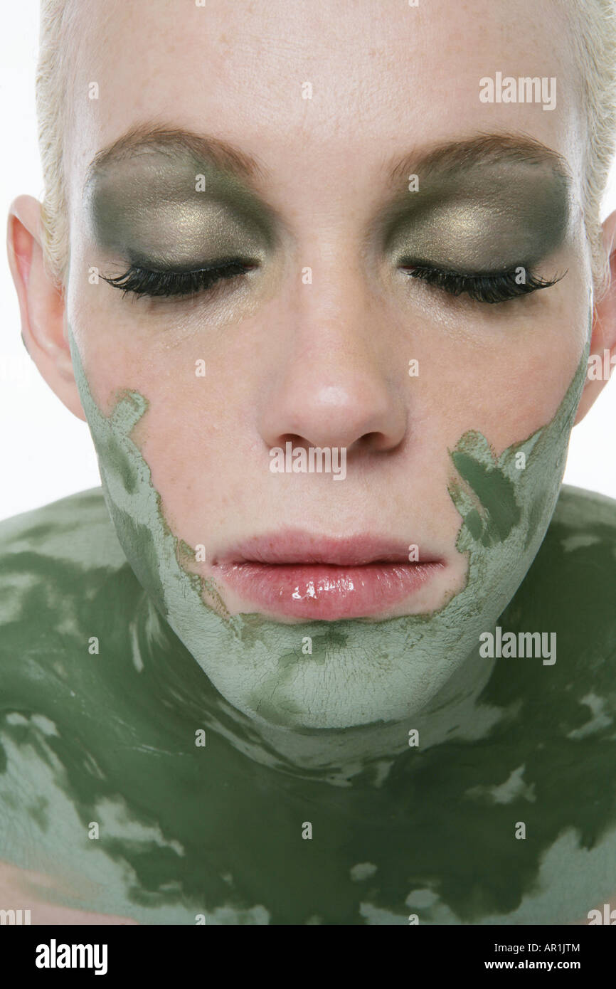Young woman wearing a green mask on her face, neck and shoulders Stock ...