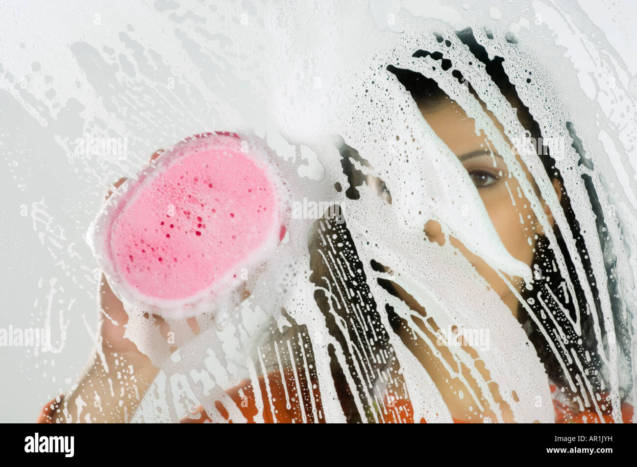 Lady cleaning glass soap hi-res stock photography and images - Alamy