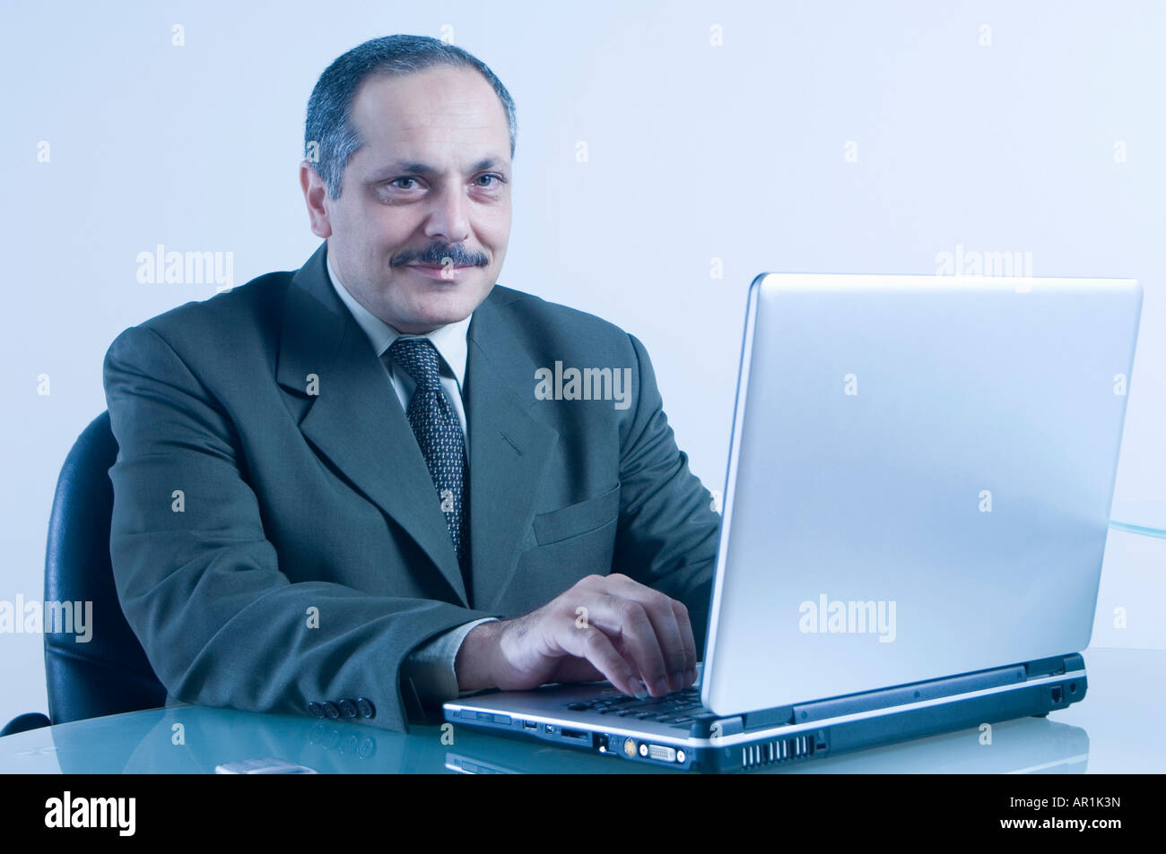 Business man at the computer Stock Photo - Alamy