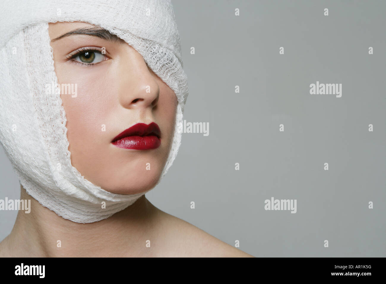 Woman with her head bandaged Stock Photo - Alamy