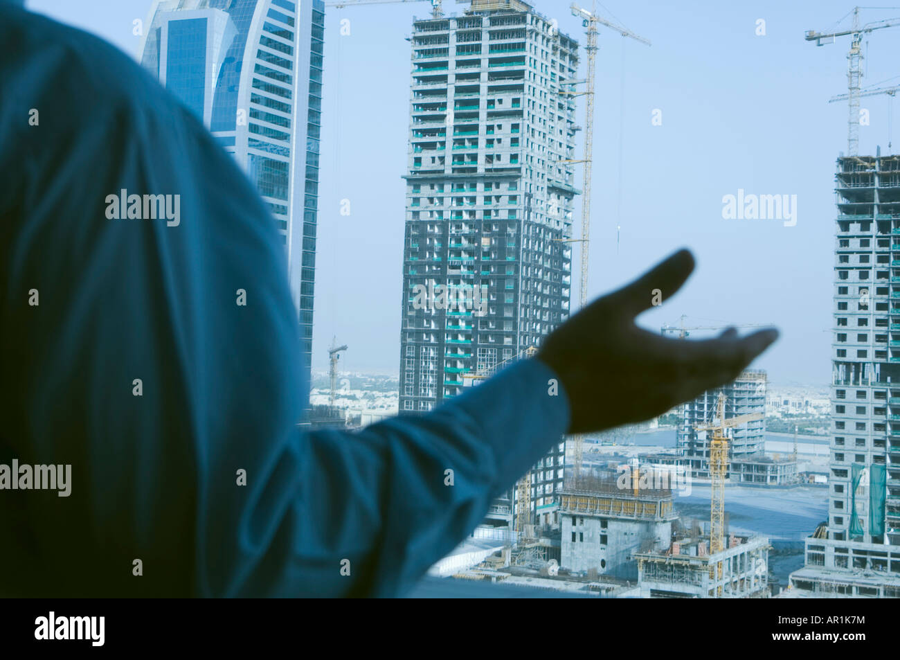 Engineer looks at the building constructions in Dubai Stock Photo - Alamy