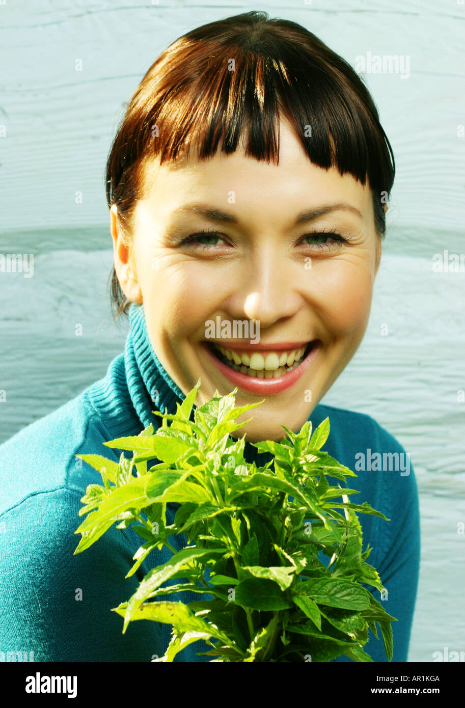 indoor studio close up woman 25 30 portrait brunette forelock hold ...