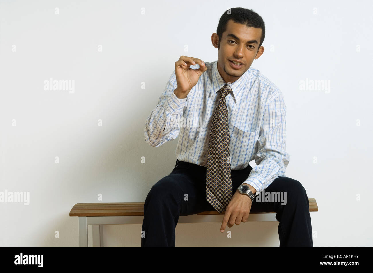 Young man saying good with hand gesture Stock Photo - Alamy