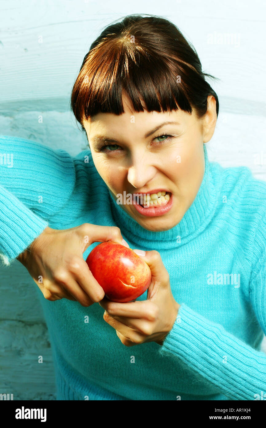 indoor studio close up woman 25 30 portrait brunette forelock apple ...
