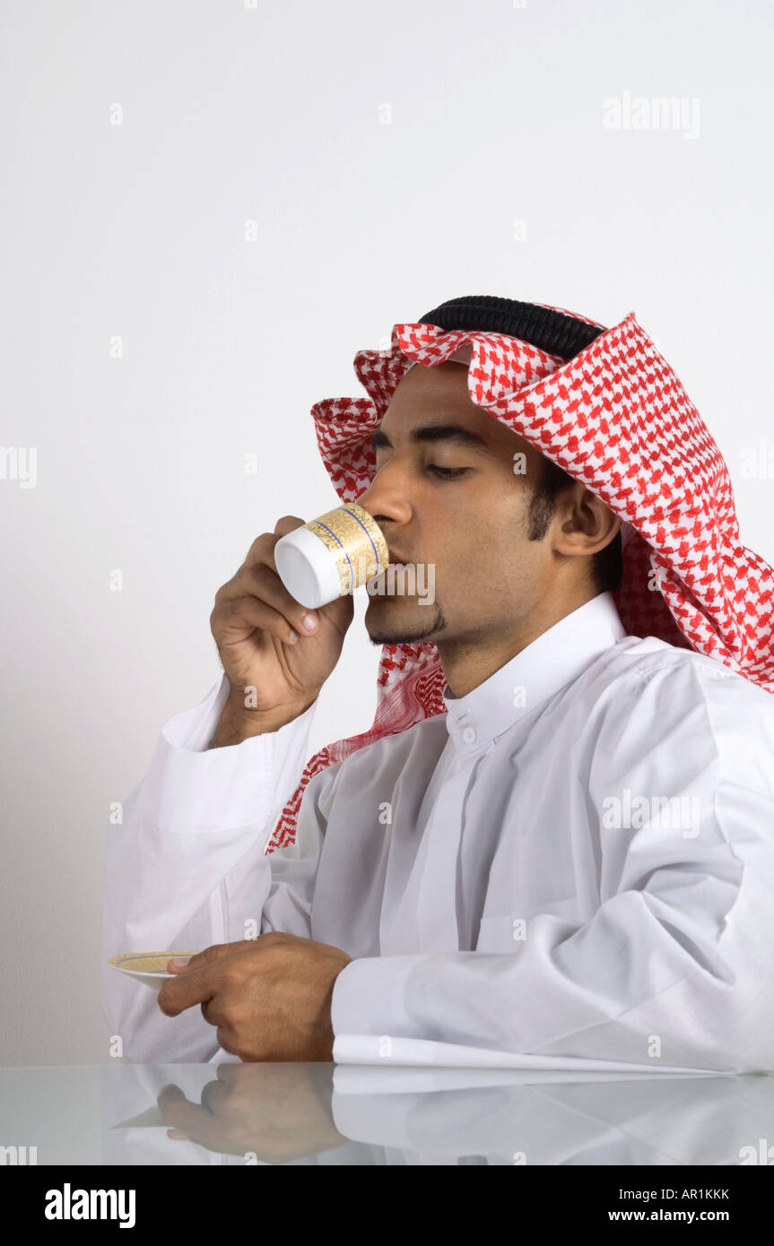 Young Arab man Drinking Coffee Stock Photo - Alamy