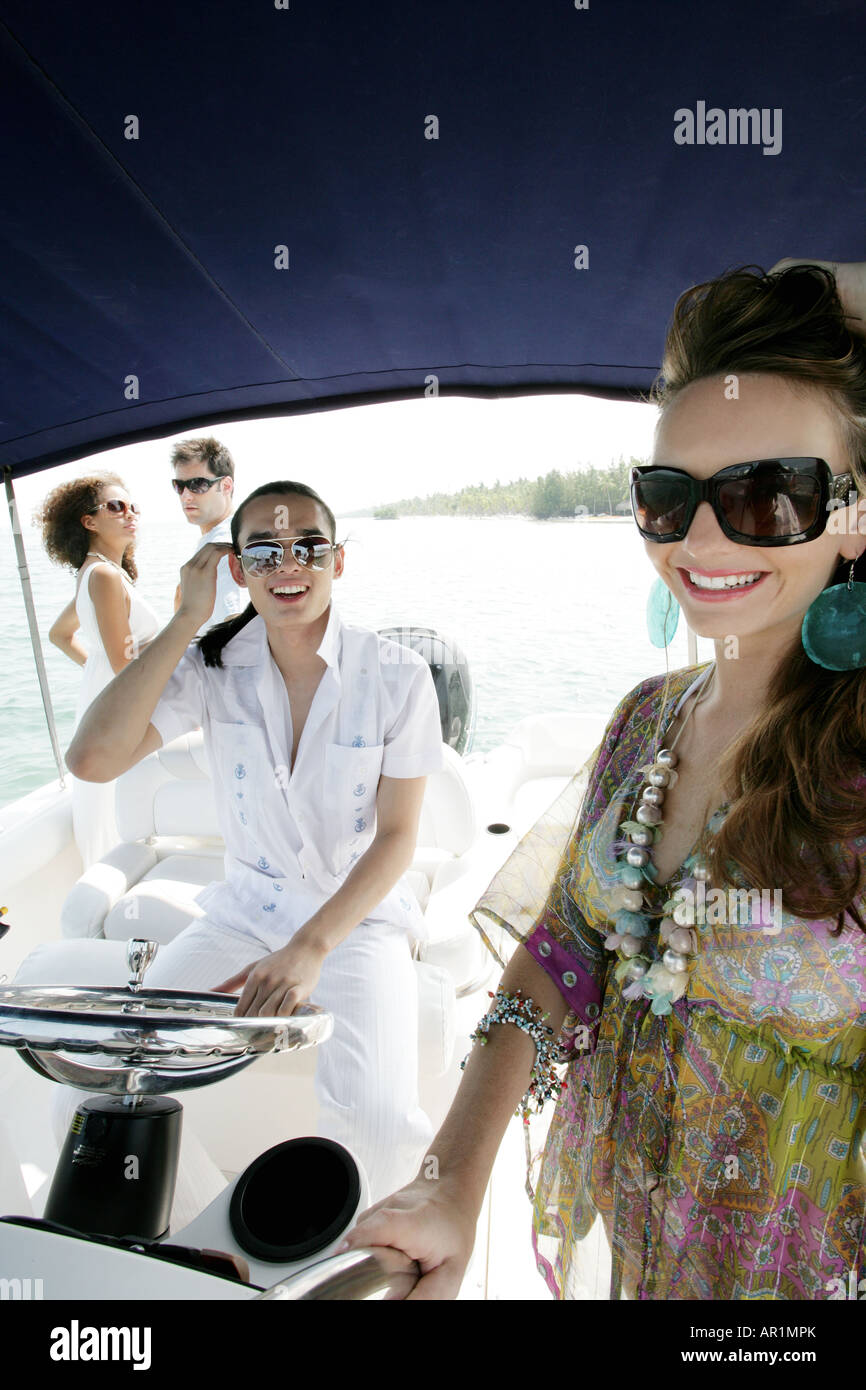 Friends relaxing on boat Stock Photo - Alamy