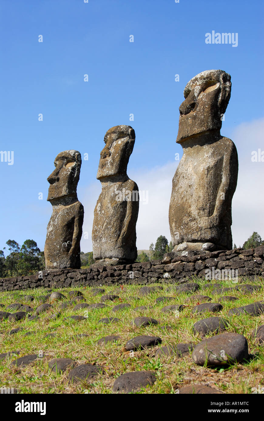 Chile Easter Island Ahu Akiva 3 three moai in row left with blue sky ...