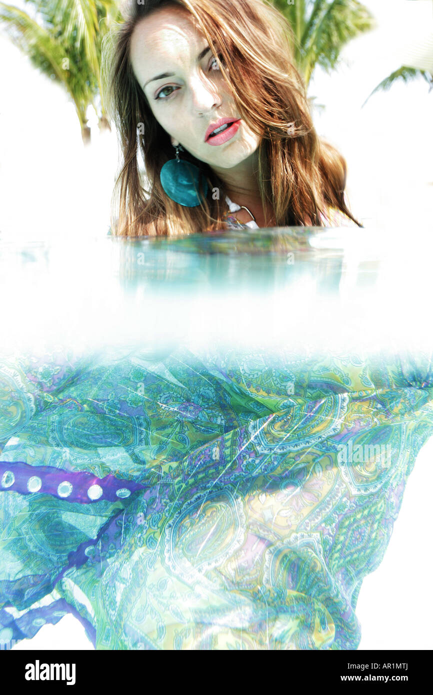 Fully-dressed young woman underwater Stock Photo - Alamy