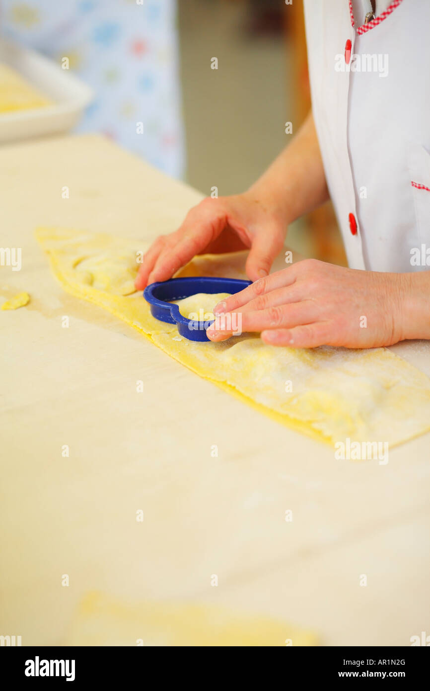 Preparation of hart-shaped ravioli, Italy Stock Photo - Alamy