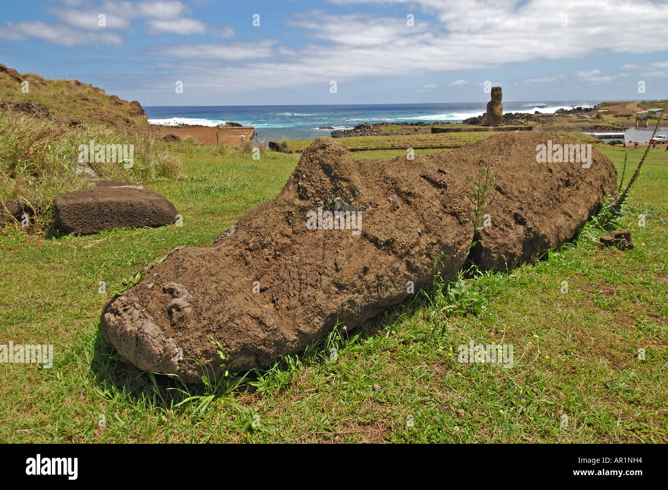 Chile Easter Island Ahu Riata fallen moai statue closeup with standing ...