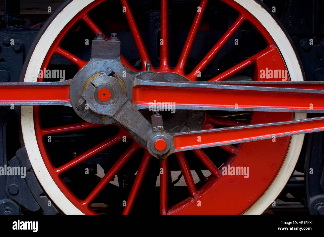 Closeup of a red painted wheel on a steam locomotive on display in the ...