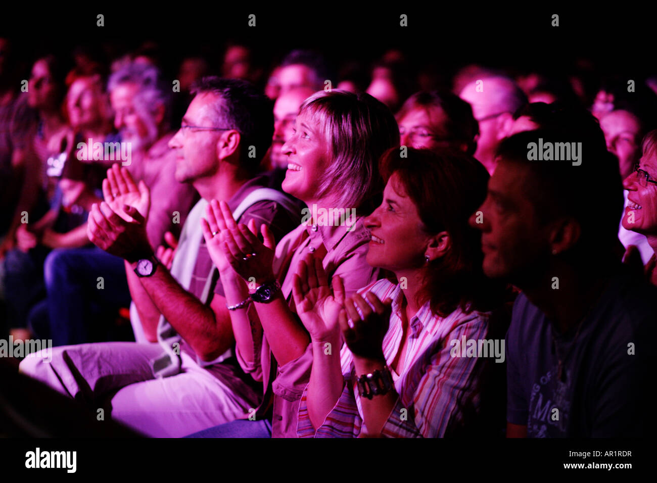 Audience watching a show in a small theatre Stock Photo - Alamy