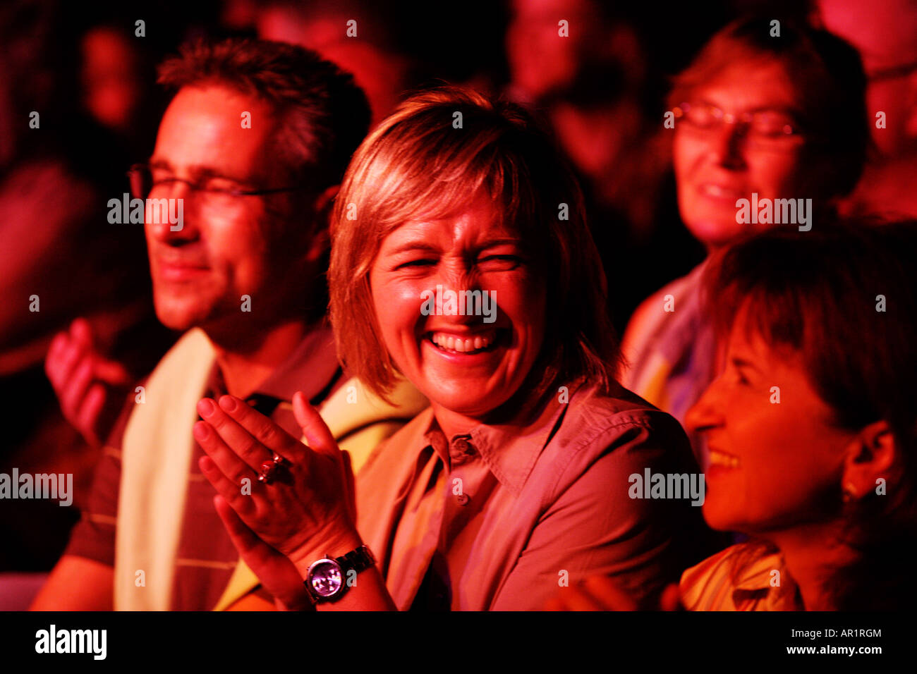 Audience watching a show in a small theatre Stock Photo - Alamy