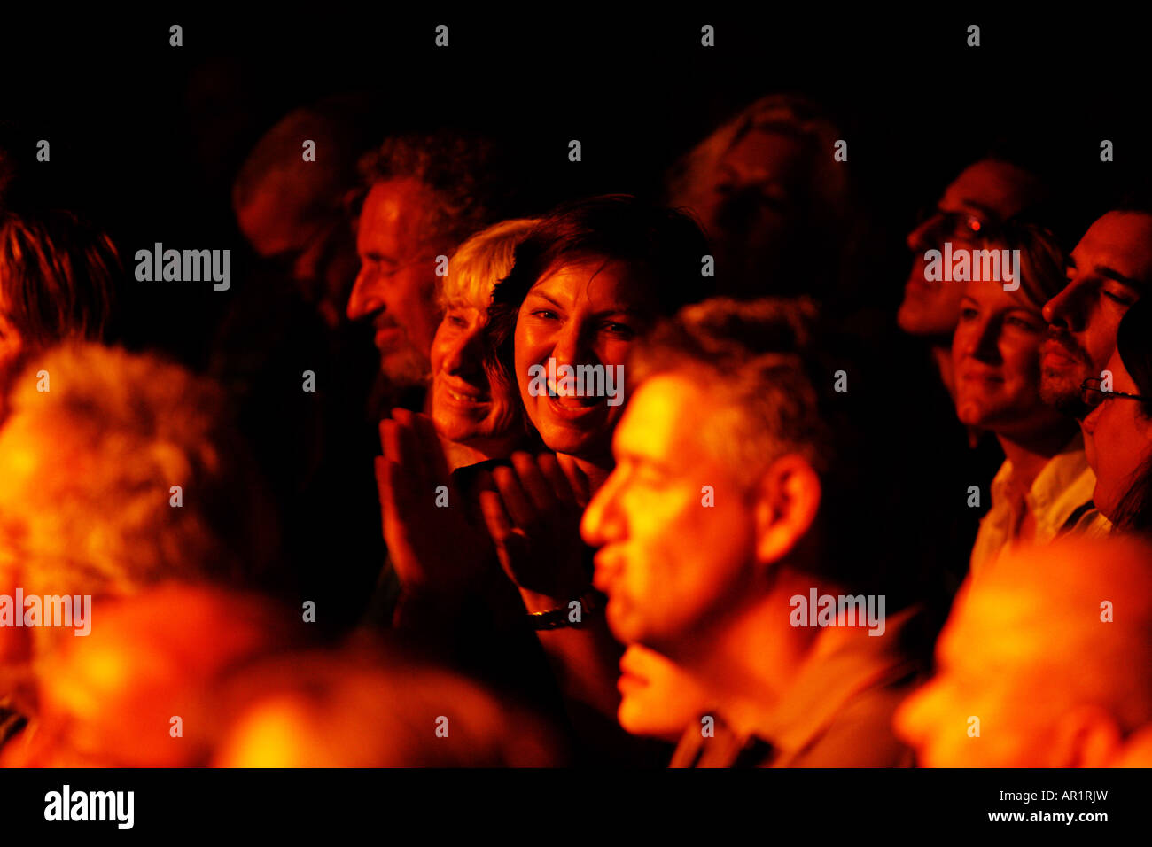 Audience watching a show in a small theatre Stock Photo - Alamy