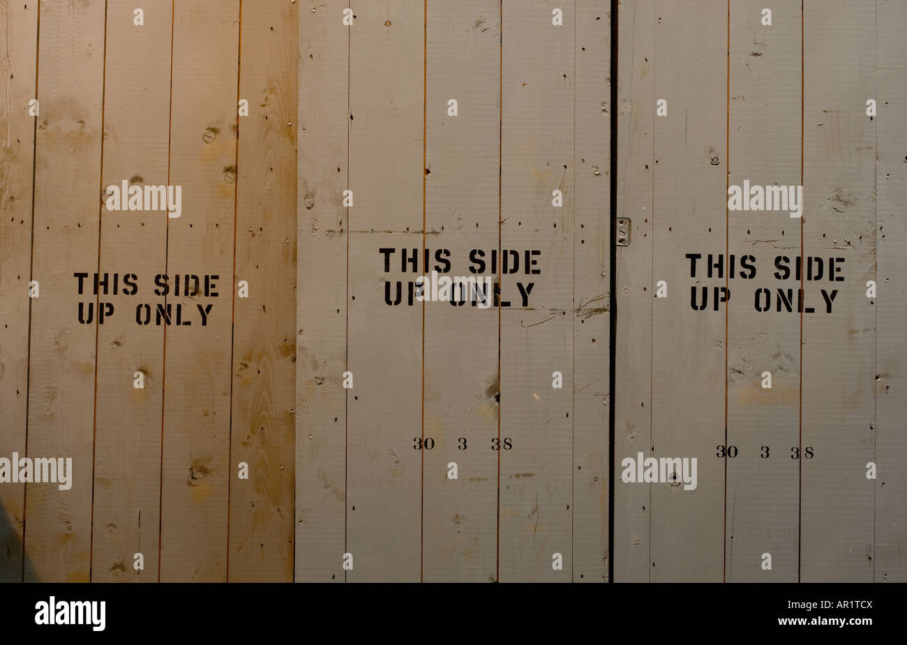 Large wooden packing crates with the words This Side Up Only painted on ...