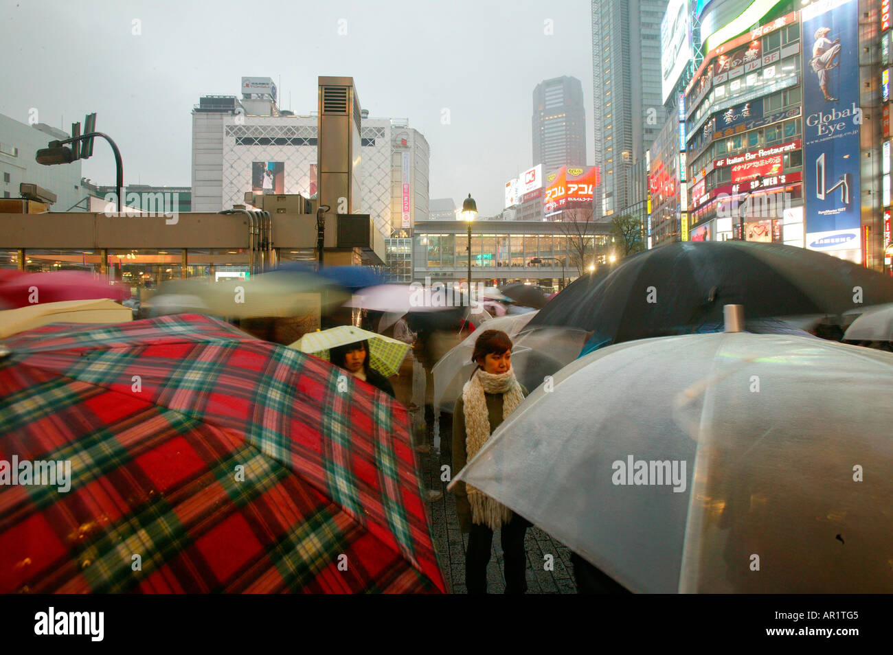Crowded square in rain, Tokyo, Japan Stock Photo - Alamy