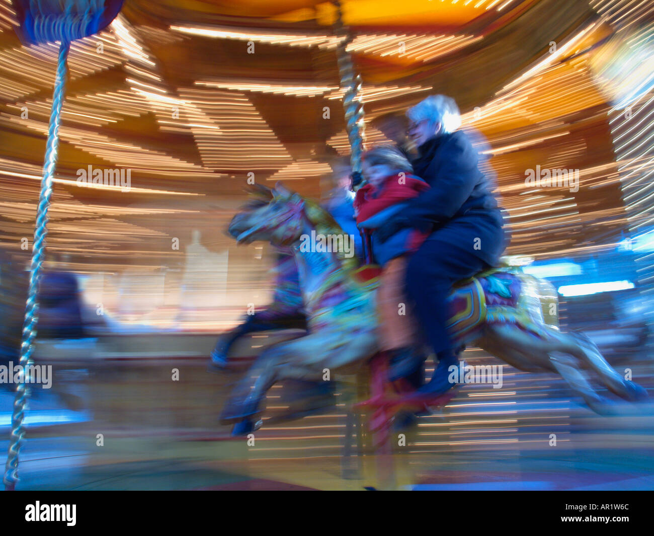 Woman child on "Merry go Round" Edinburgh Scotland Stock Photo - Alamy