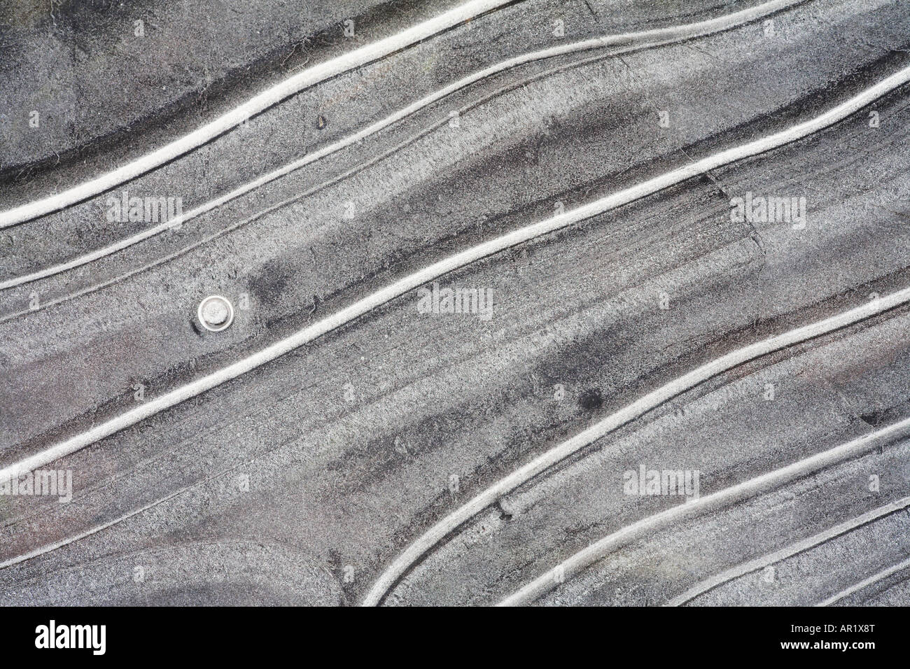 Ice patterns in a frozen New Forest stream, New Forest National Park ...
