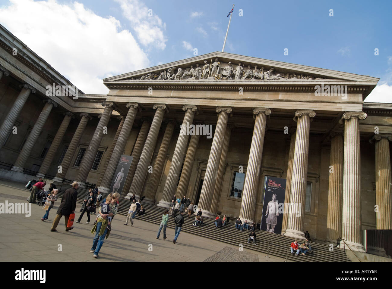 Horizontal wide angle of lots of tourists outside the grand entrance of ...