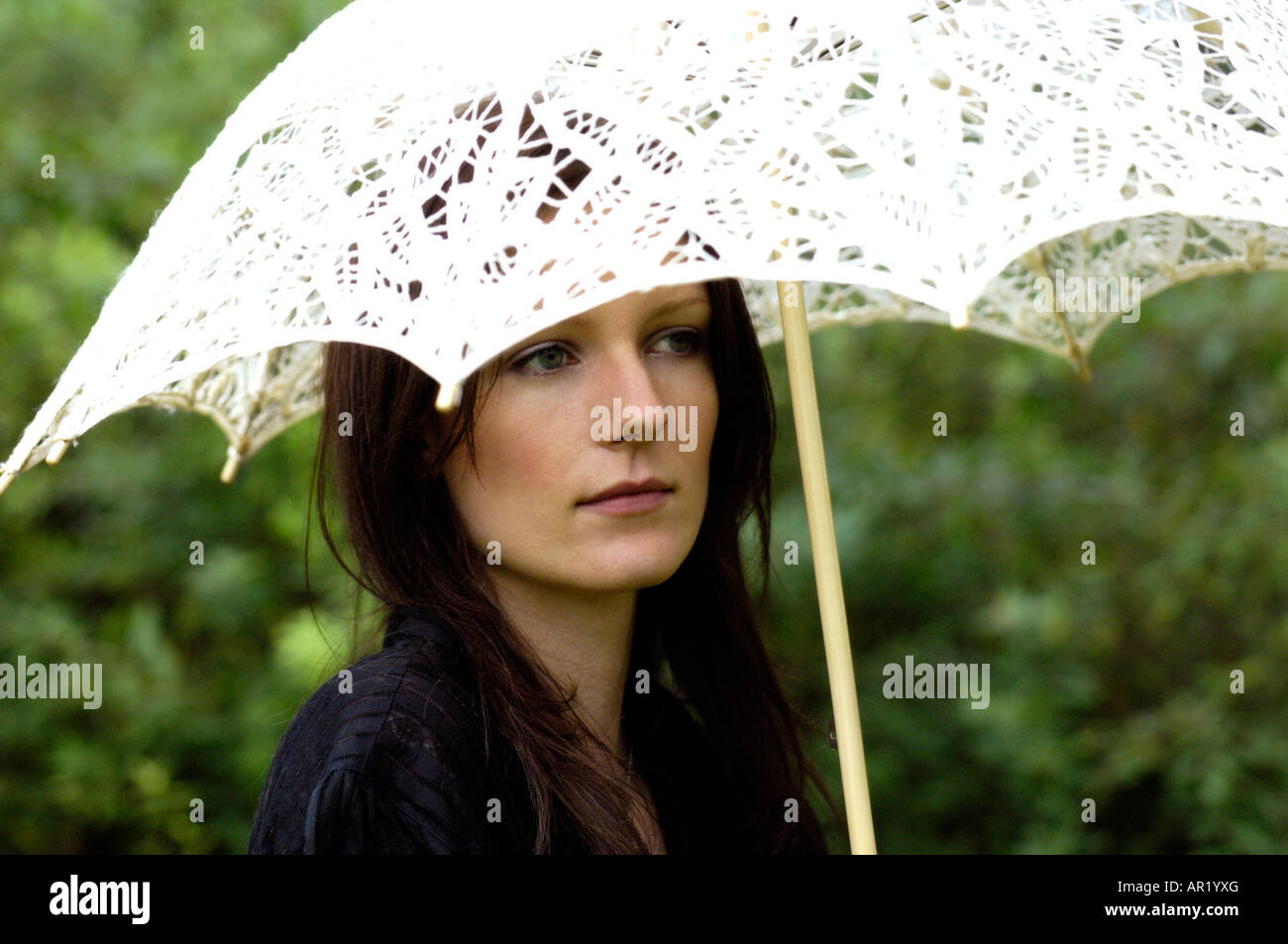 Woman with parasol hi-res stock photography and images - Alamy