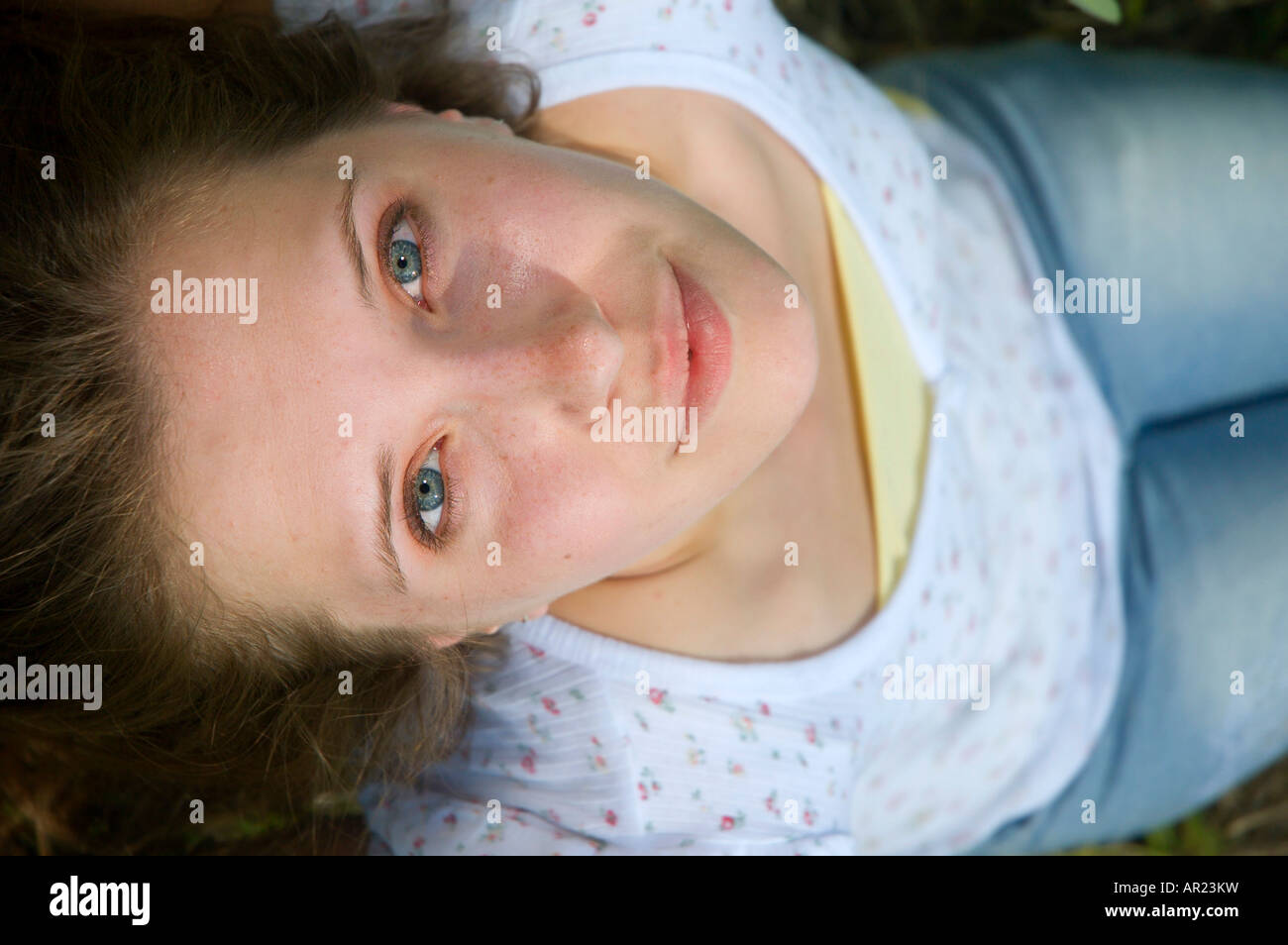 Cute girl with amazing eyes looking up Stock Photo - Alamy