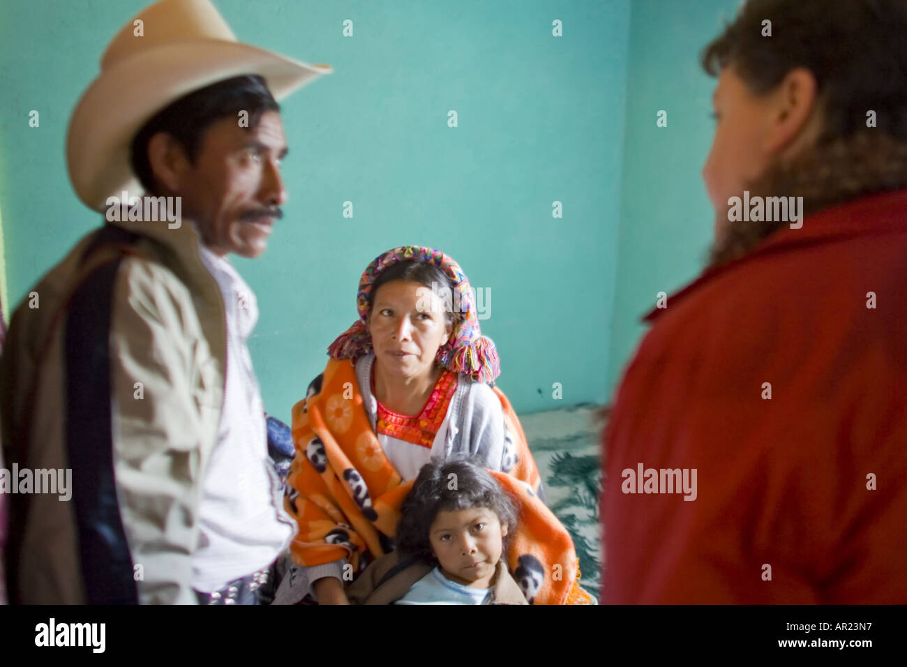 GUATEMALA CAPELLANILLA Indigenous Maya Ixil family in colorful ...