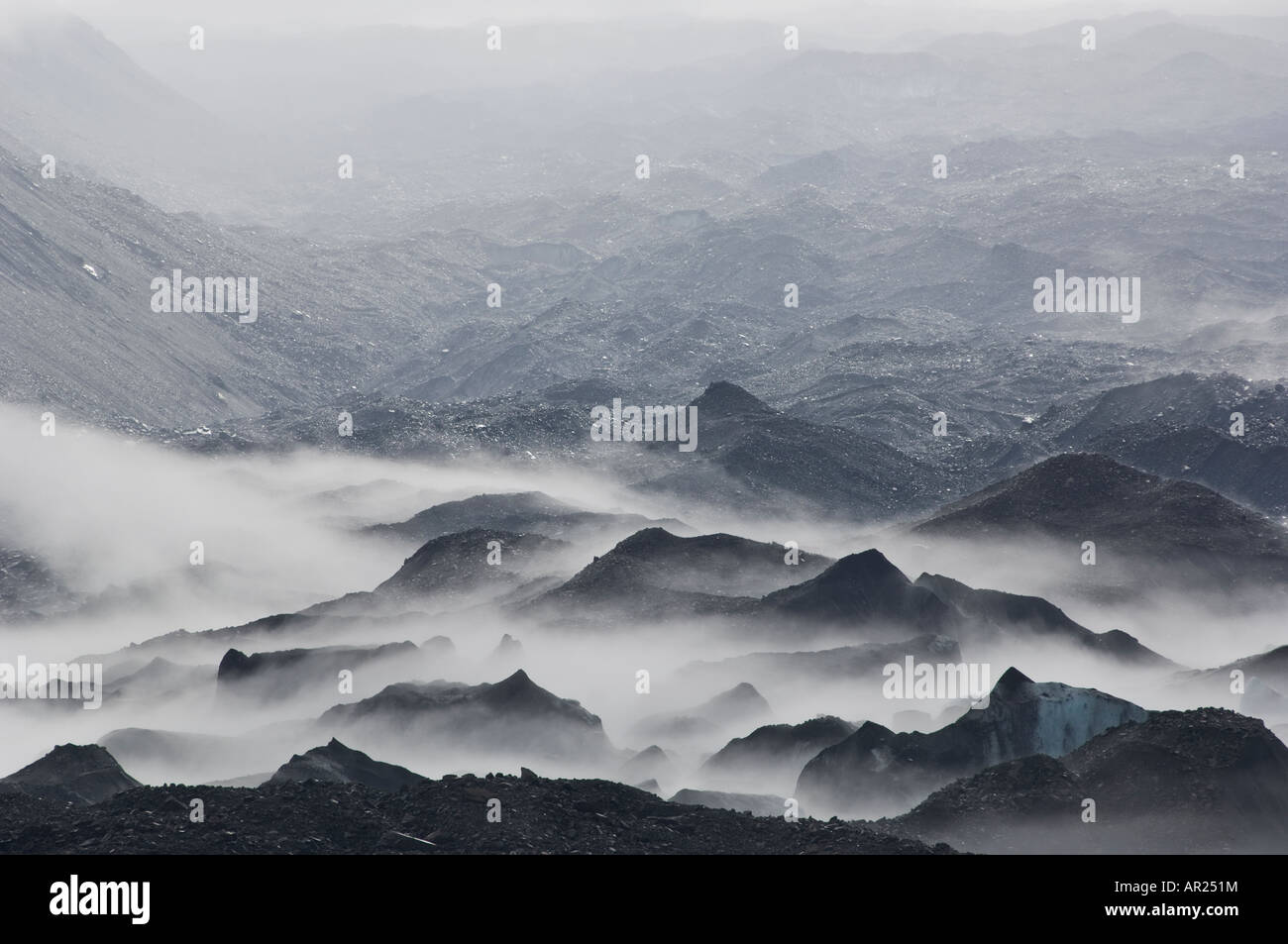 Mist forming over Tasman glacier during storm, Mount Cook national park ...