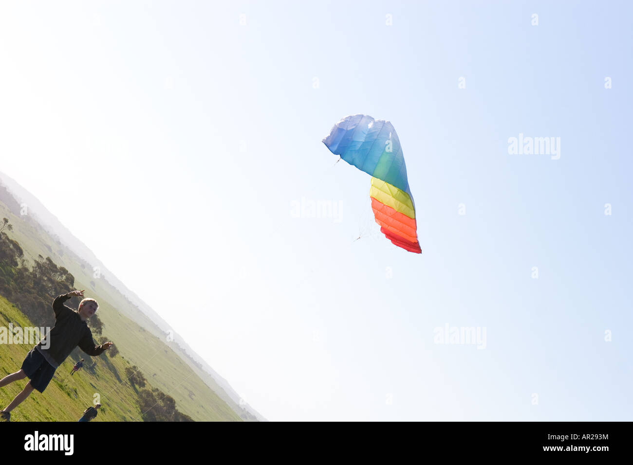 Boy flying kite Stock Photo - Alamy